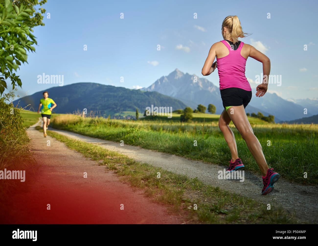 Woman running on mountains hi-res stock photography and images - Alamy