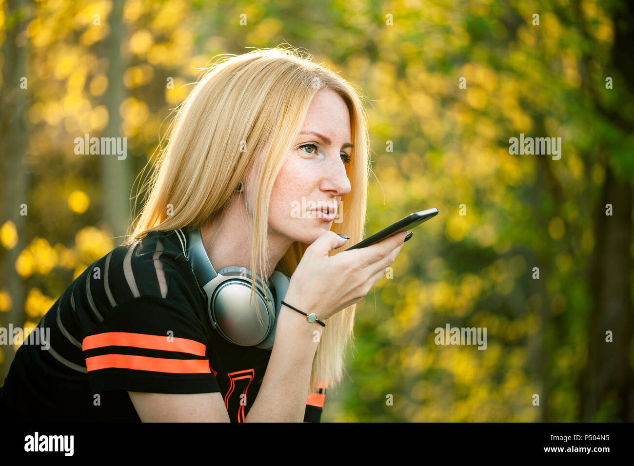 Woman calling headphones hi-res stock photography and images - Alamy