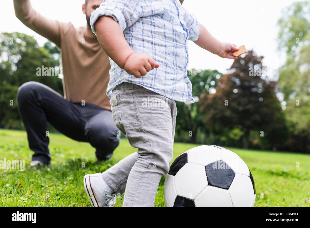 Father playing football with son hi-res stock photography and images ...
