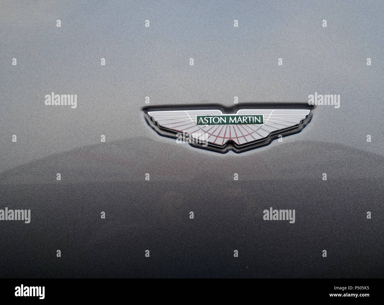 Aston Martin car emblem, off-centre Stock Photo - Alamy