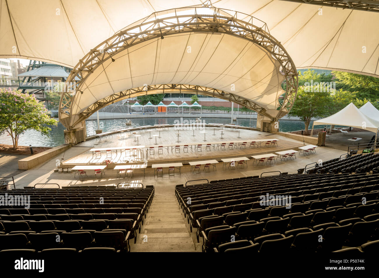 Seating and stage of a performance venue along a river Stock Photo - Alamy