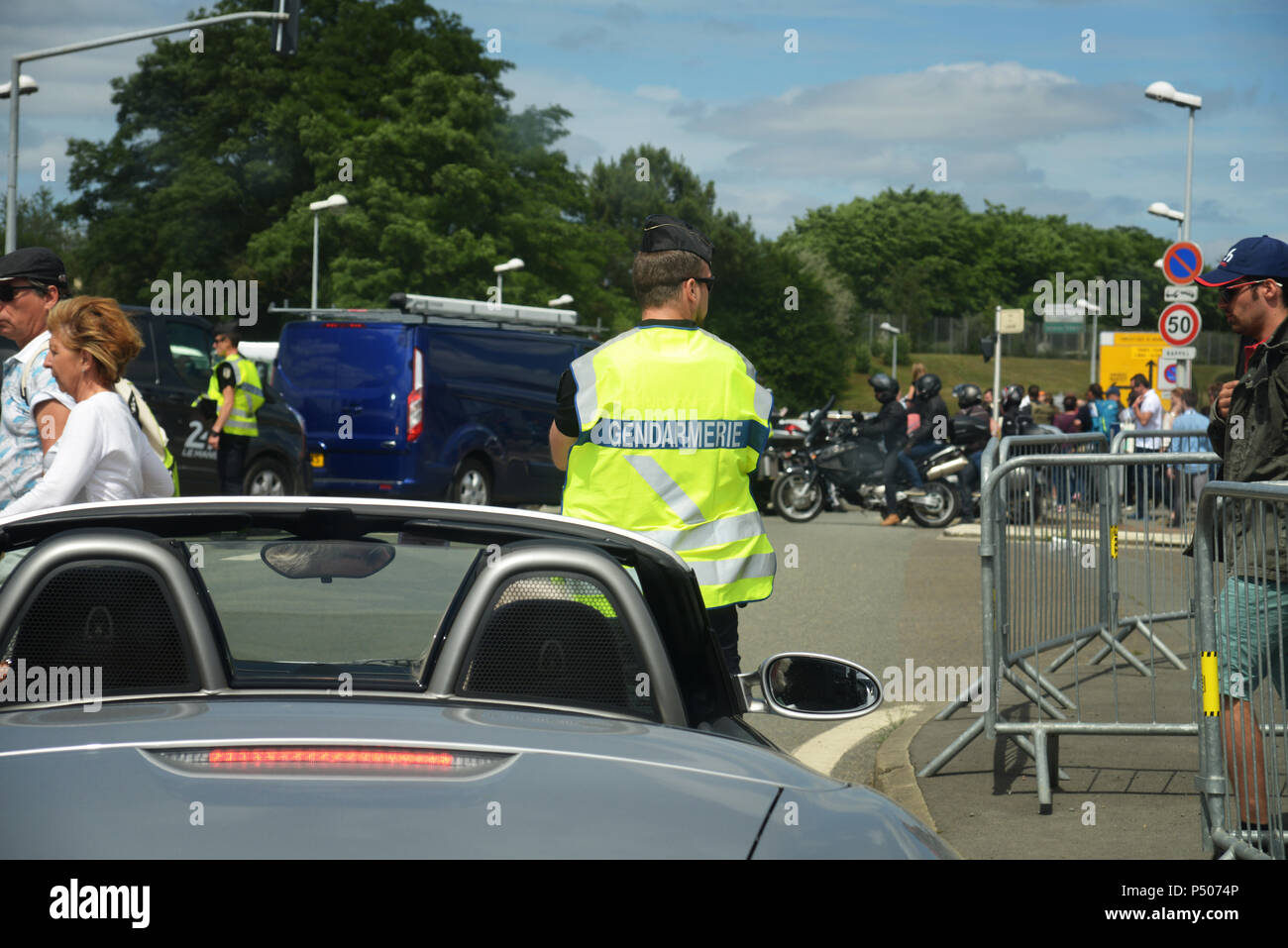 French gendarme Waiting in traffic at the start of the 24 hours Le Mans ...