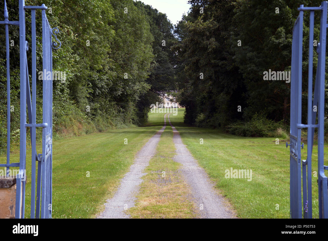 Long drivway through big gates leading to a mystery house near Le Mans ...