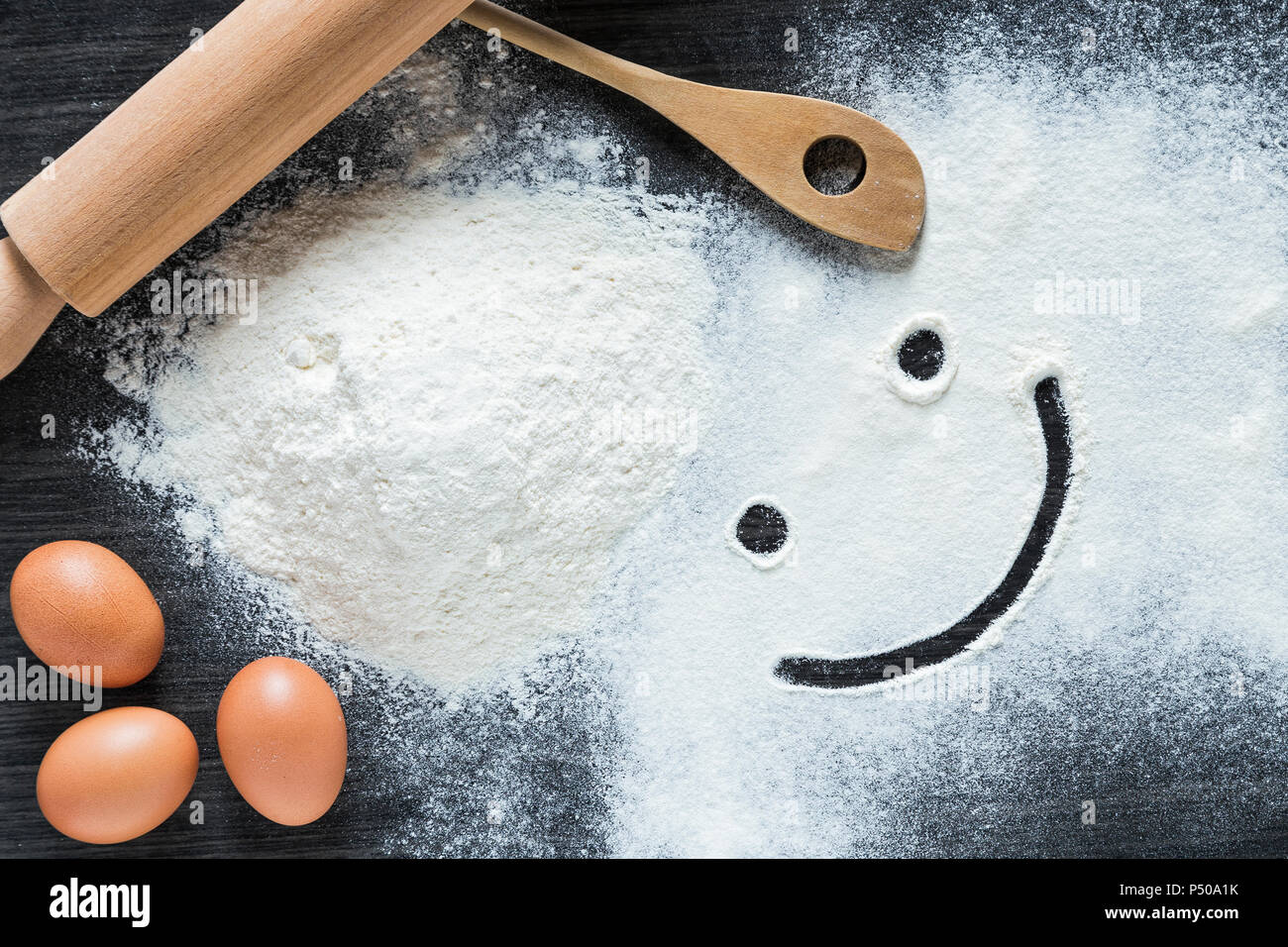 Baking background with a rolling pin, flour and raw eggs Stock Photo ...