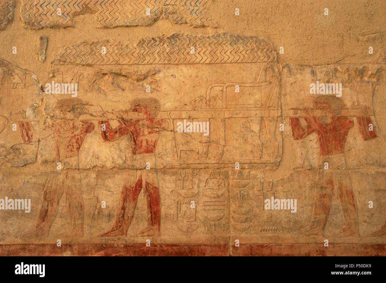 EGYPTIAN ART. Relief depicting servants carrying a throne. Temple of ...