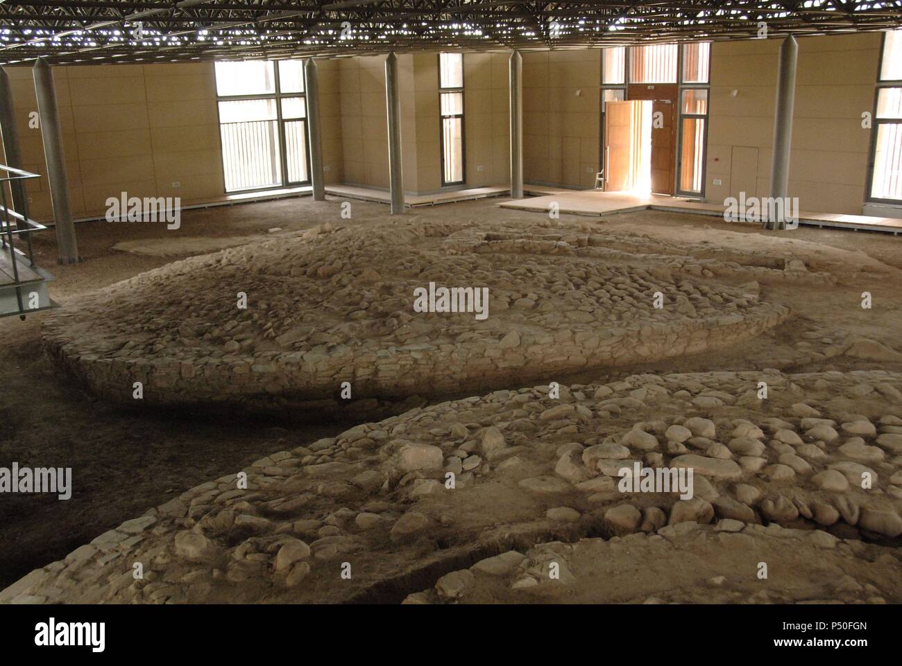 Cemetery of Vranas. Burial mound formed by a double circle of stones ...