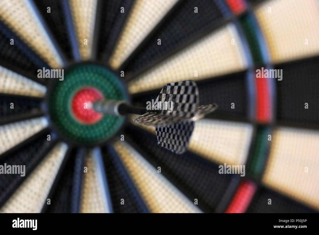 a dart hits target in the centre of dartboard Stock Photo - Alamy