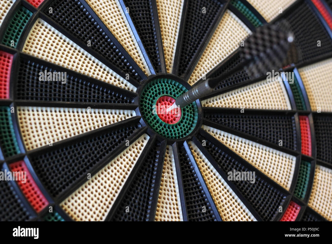 a dart hits target in the centre of dartboard Stock Photo - Alamy