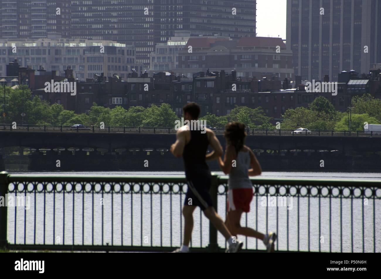 Couple jogging along the Charles River. Boston. State of Massachusetts ...