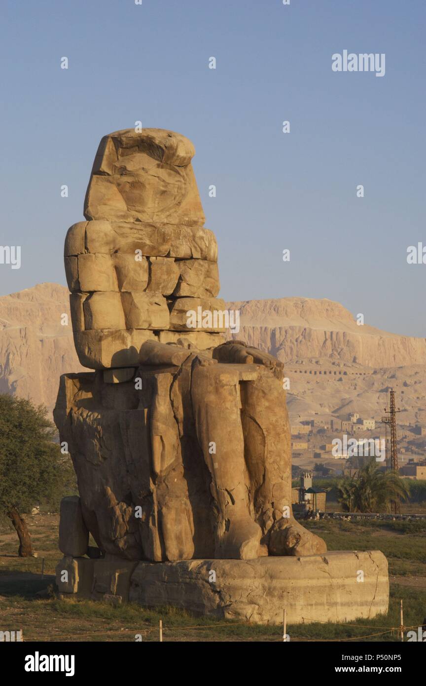 Colossi of Memnon. Stone statues depicting pharaoh Amenhotep III (14th ...
