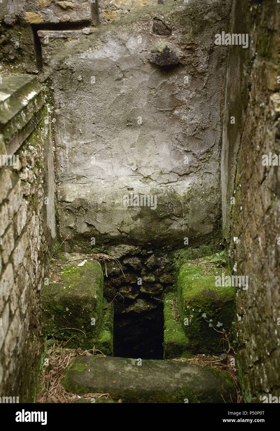 Pompeii. Ancient Roman city. View of an old roman latrine. Campania ...