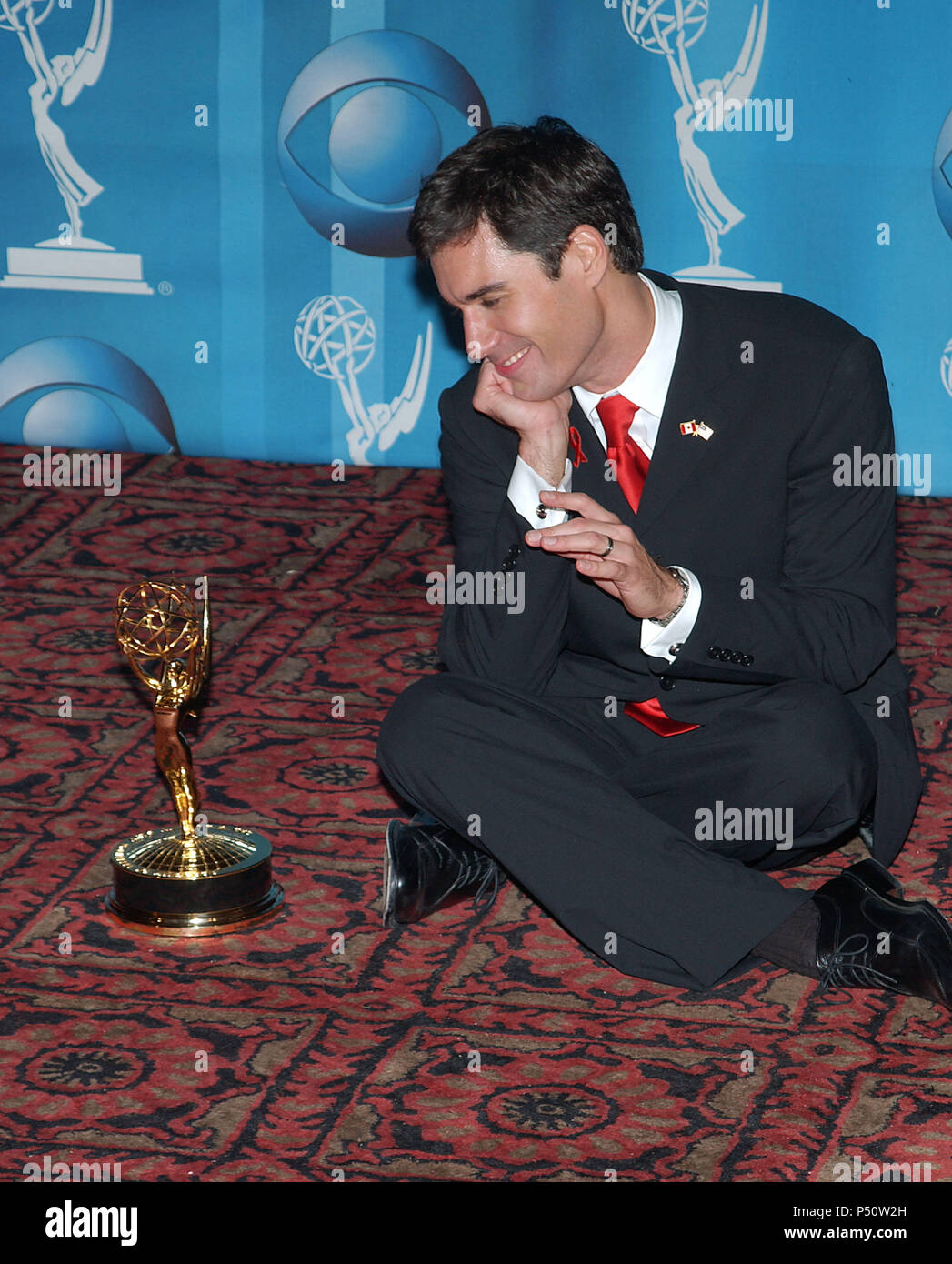 Eric McCormack admires his Emmy at the 53rd Primetime Emmy Awards at ...