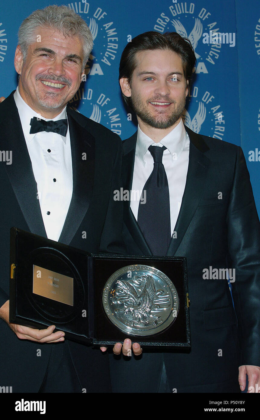 Gary Ross nominated for best director posing with Tobey Maguire at the ...