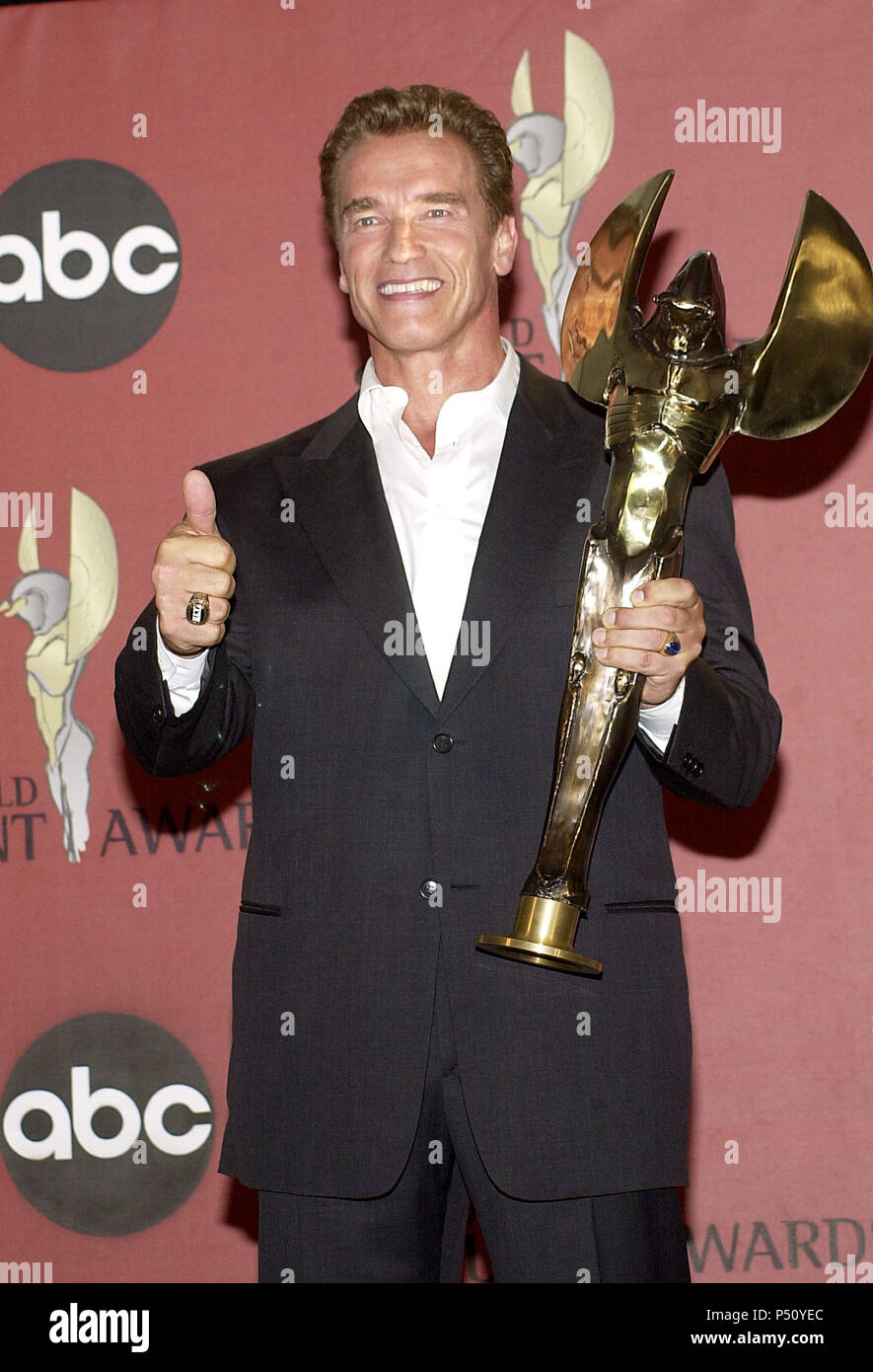 Arnold Schwarzenegger posing backstage at the 1st World Stunt Awards at ...