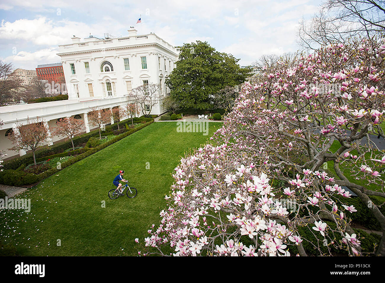 President George W. Bush rides his bike through the Rose Garden, March ...