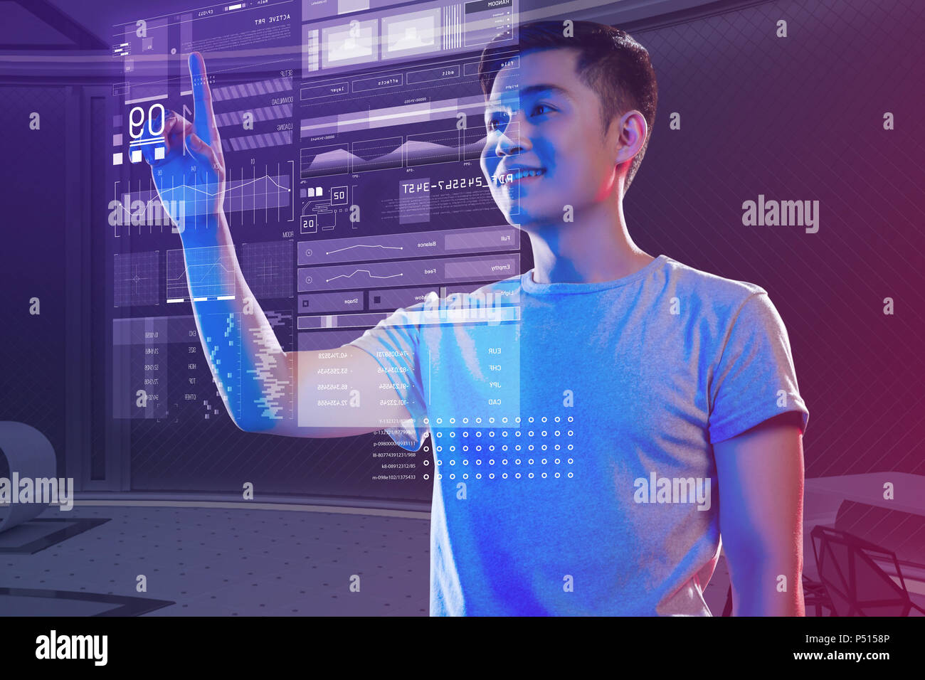 Happy programmer smiling while touching the holographic image Stock ...