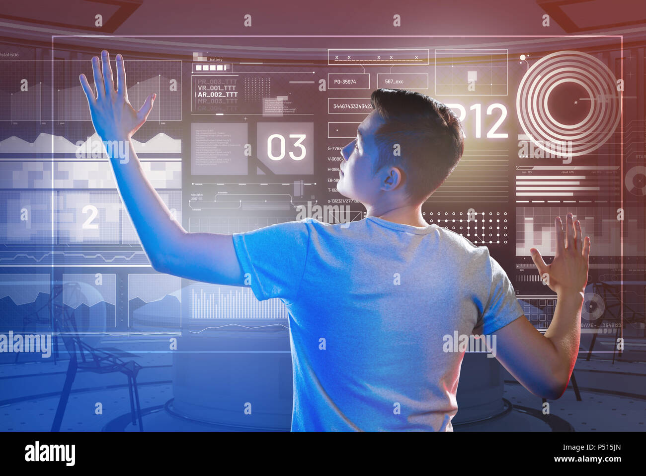 Attentive software developer touching the transparent screen with two hands Stock Photo - Alamy