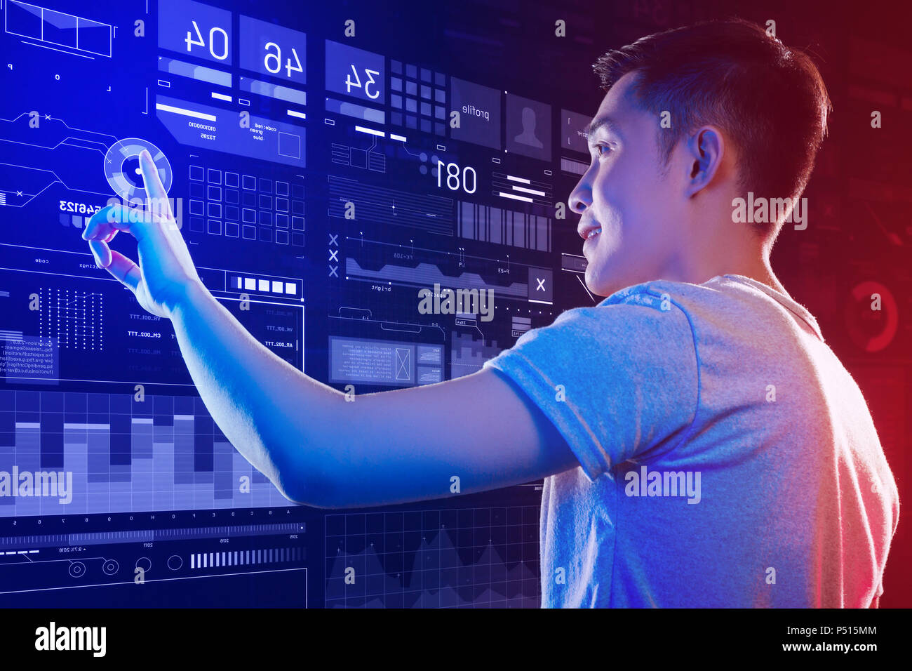 Clever programmer touching the screen while working at the new program Stock Photo - Alamy