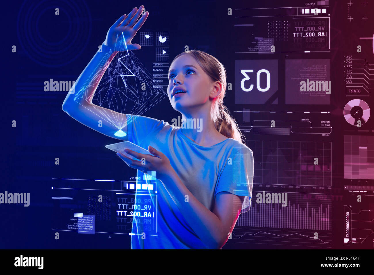 Clever pupil feeling glad while creating a realistic hologram Stock ...