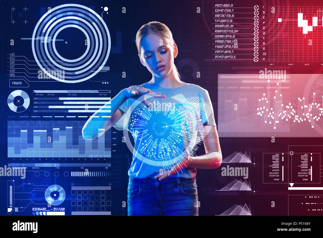 Curious student holding a round hologram while working at her project ...