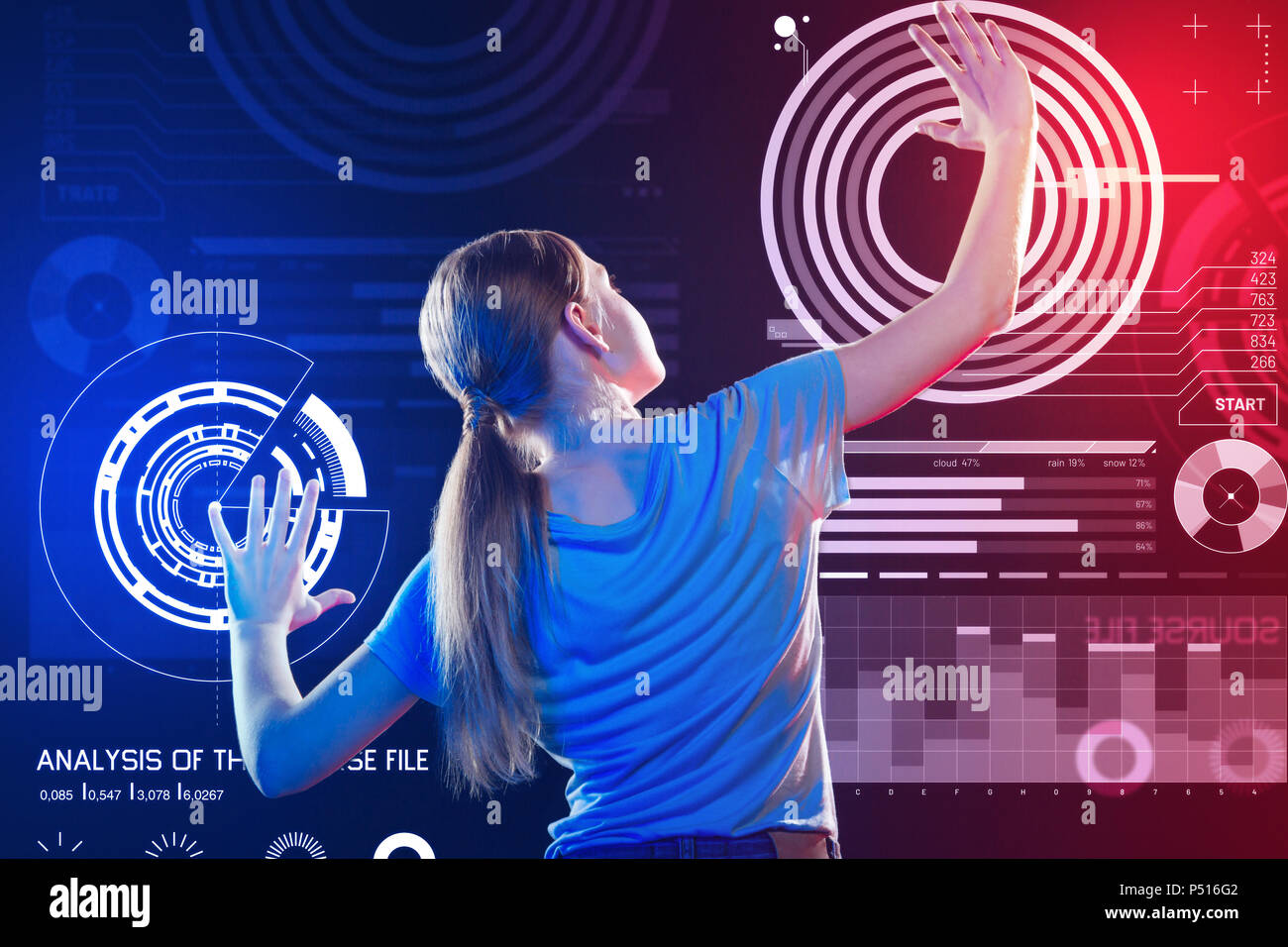 Smart student putting her hands up while touching a transparent screen ...