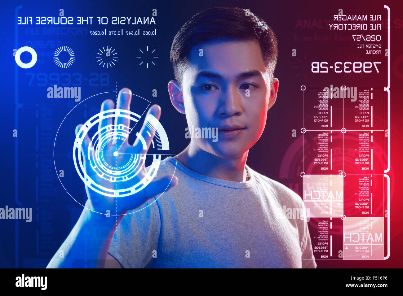 Calm web developer touching the screen while scanning his hand Stock ...