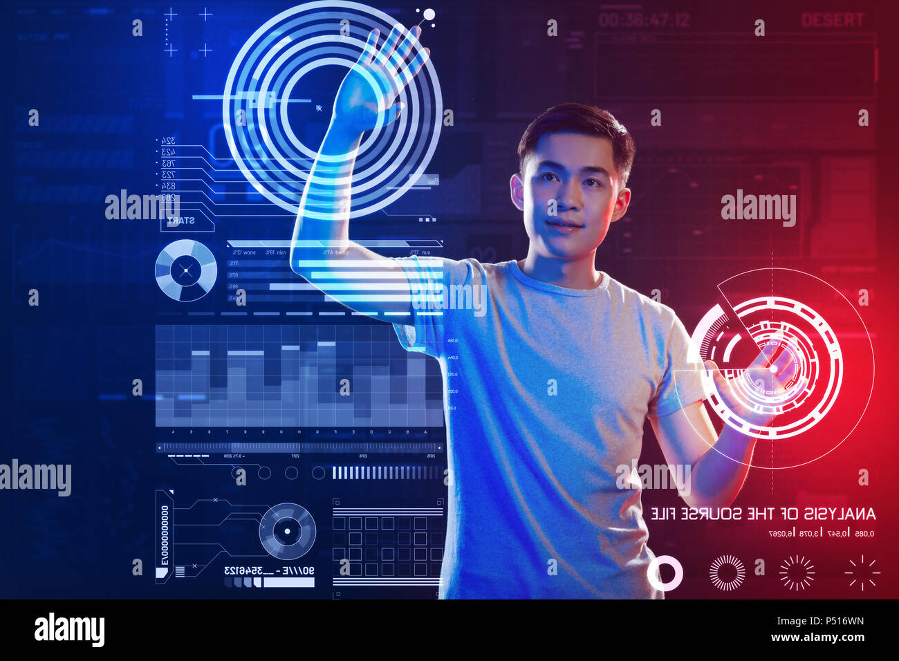 Calm programmer looking relaxed while touching the screen with his two ... Calm programmer looking relaxed while touching the screen with his two ...