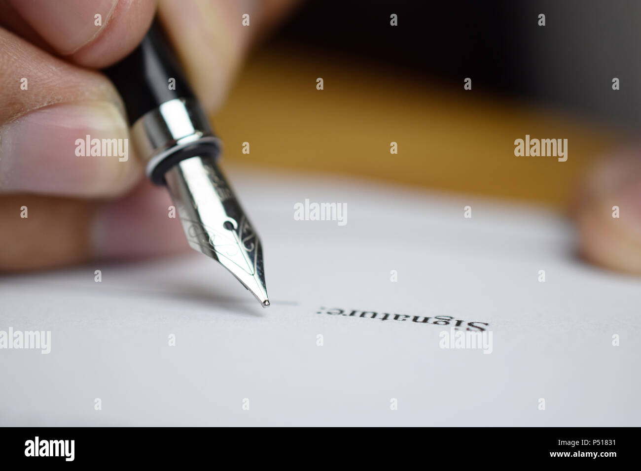 Signing a form, closeup, front view Stock Photo - Alamy