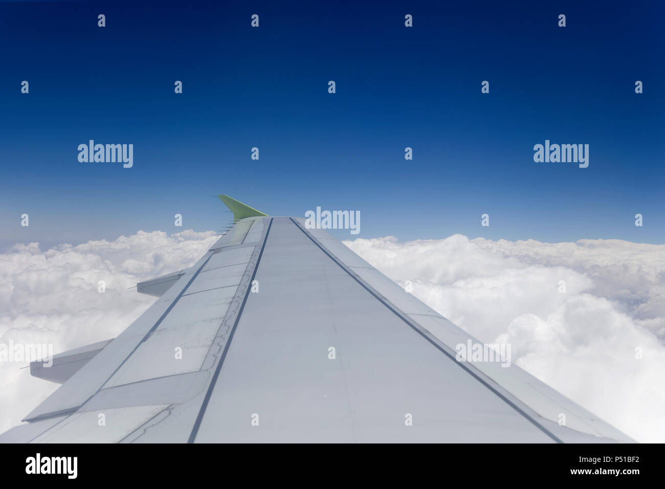 Detail of the airplane wing in the sky Stock Photo - Alamy
