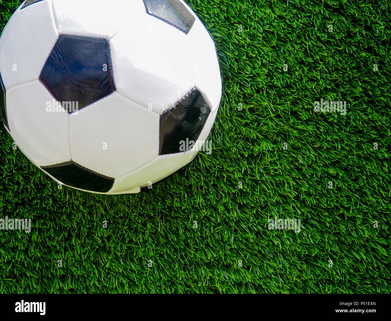 Traditional soccer ball on soccer field, playing Stock Photo - Alamy
