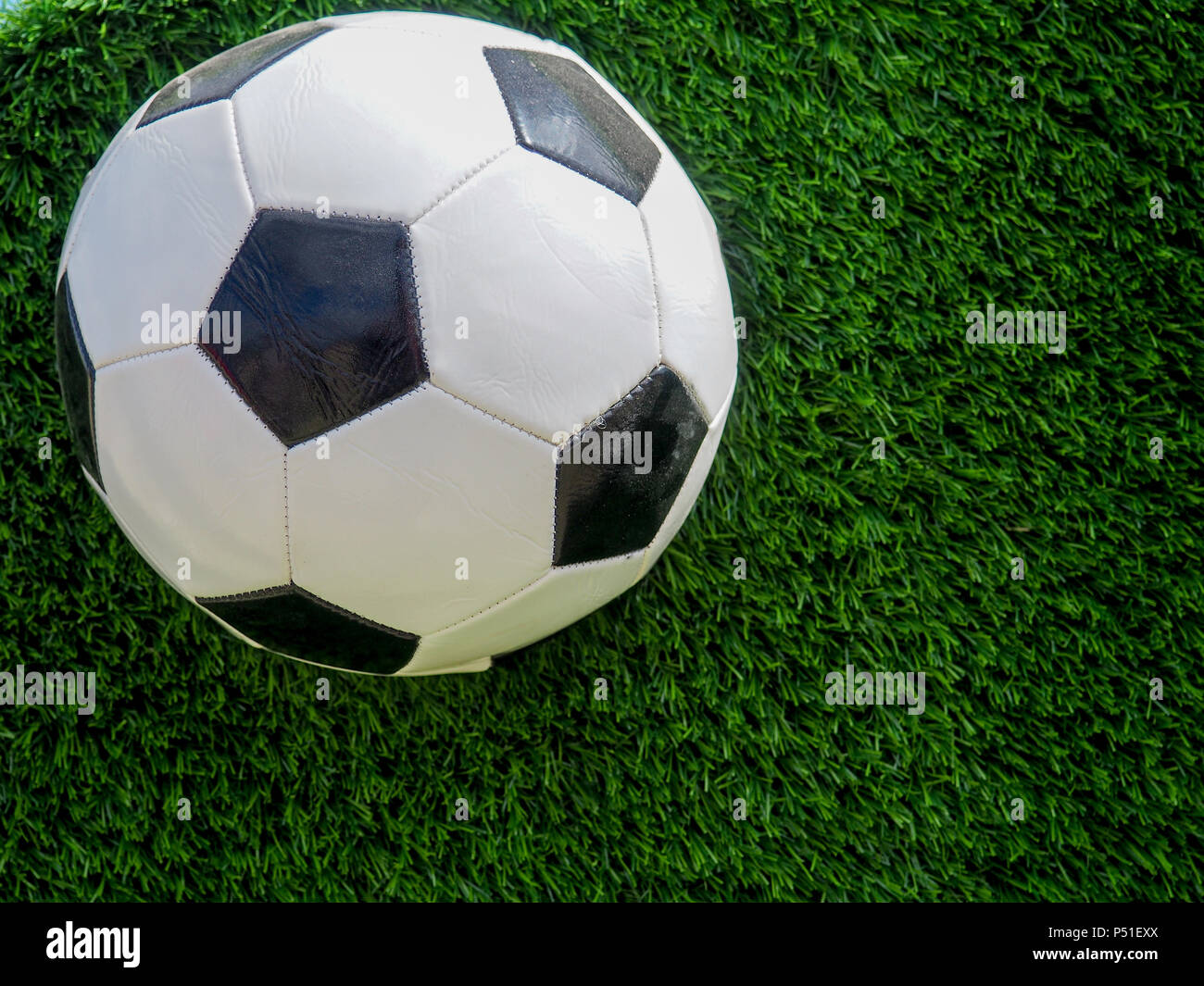 Traditional soccer ball on soccer field, playing Stock Photo - Alamy
