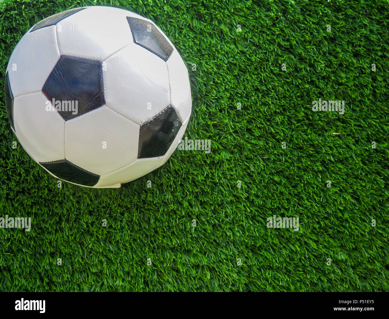 Traditional soccer ball on soccer field, playing Stock Photo - Alamy