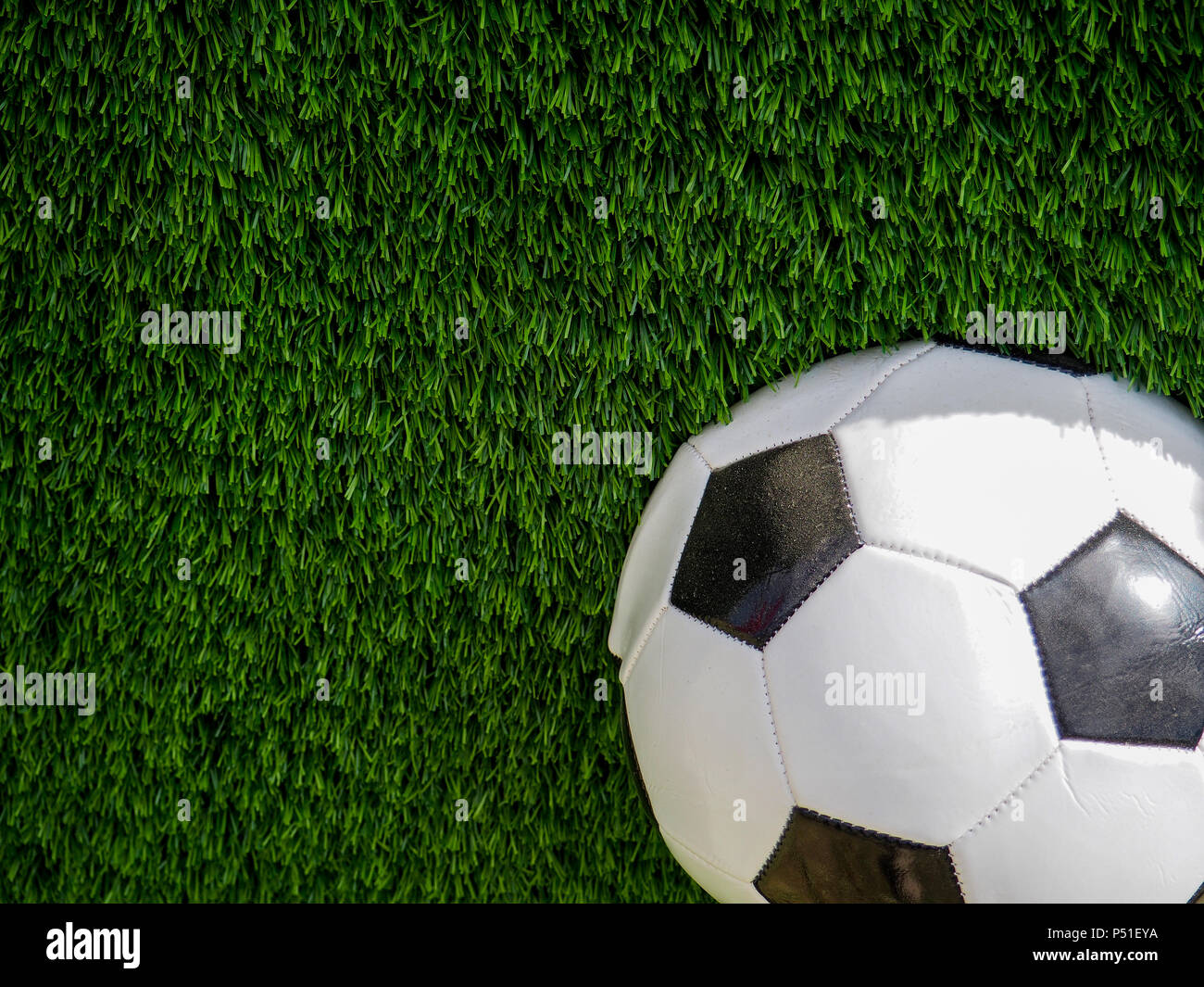 Traditional soccer ball on soccer field, playing Stock Photo - Alamy