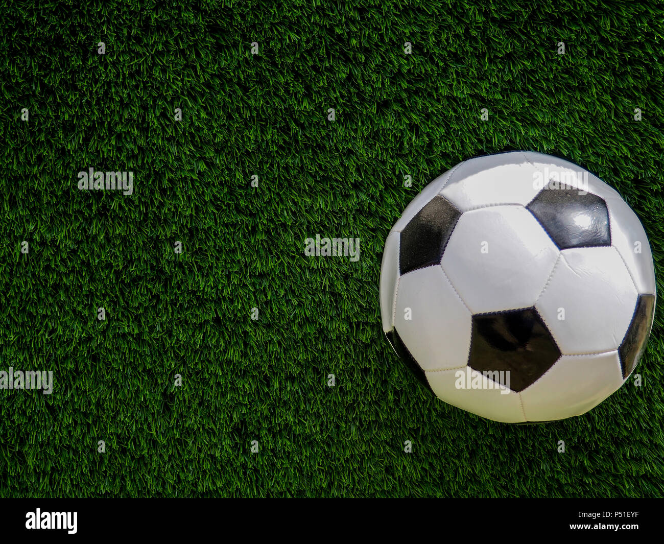 Traditional soccer ball on soccer field, playing Stock Photo - Alamy