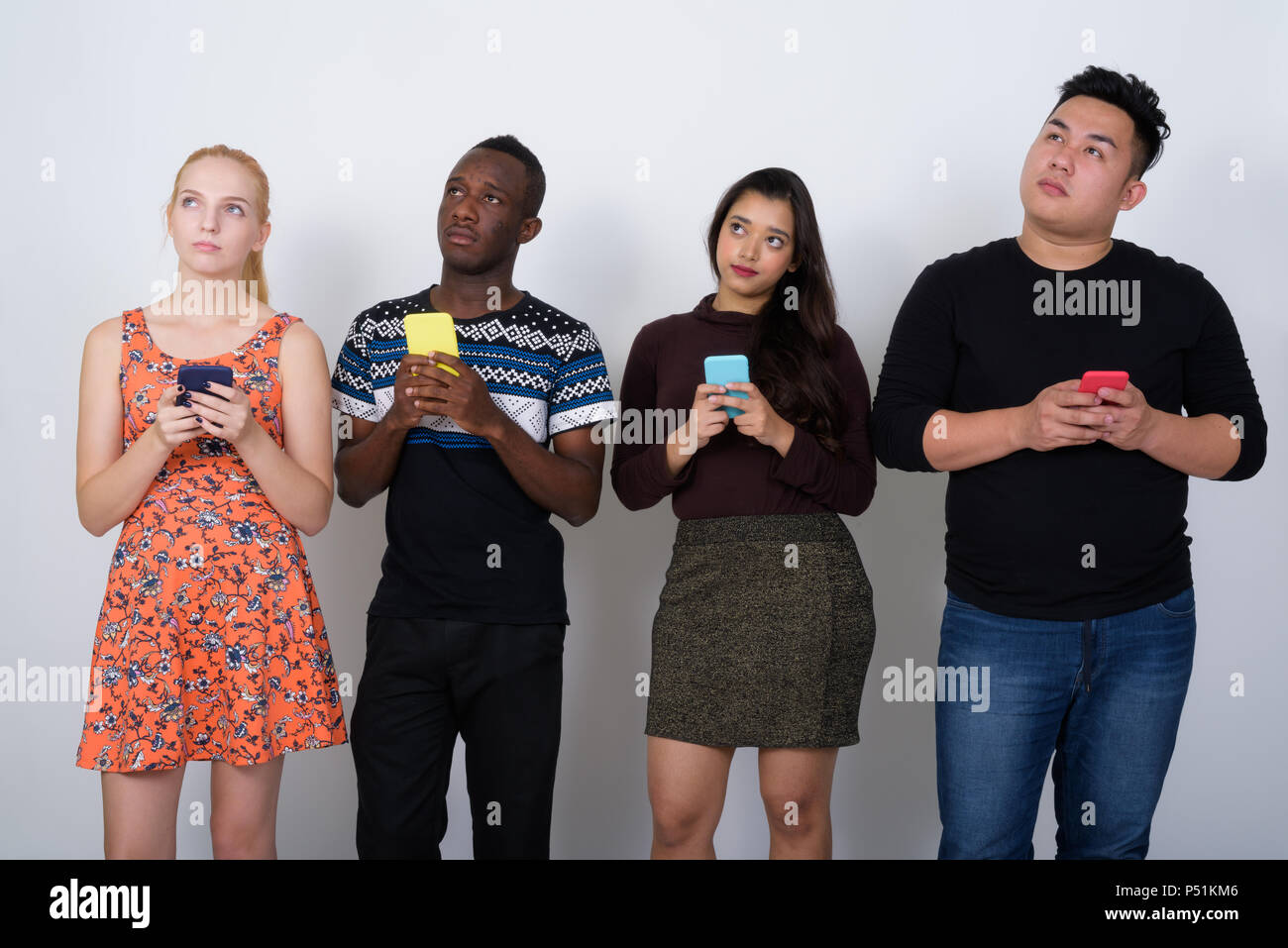 Studio shot of diverse group of multi ethnic friends thinking wh Stock ...