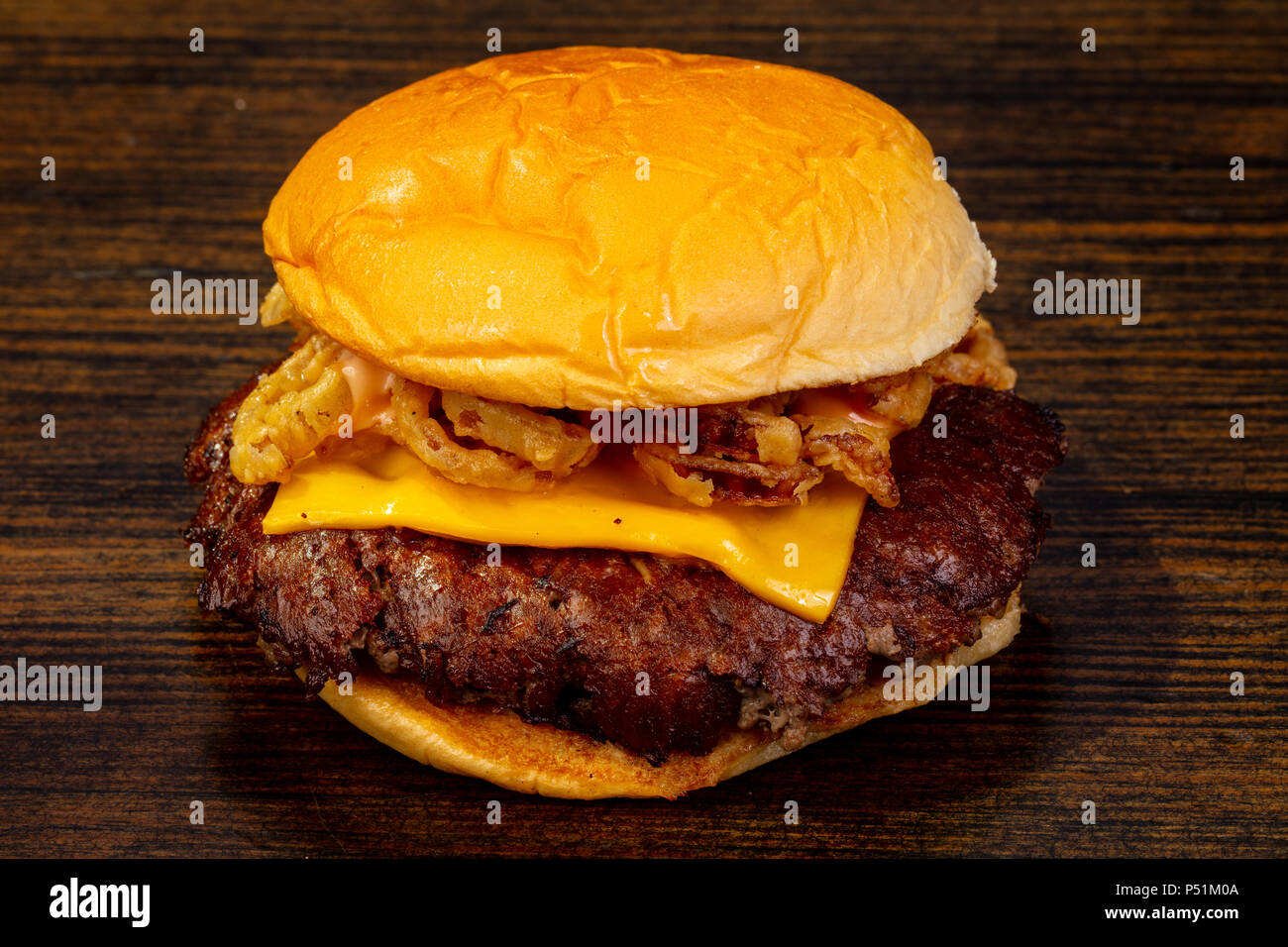 Tasty hot burger over wooden background Stock Photo - Alamy