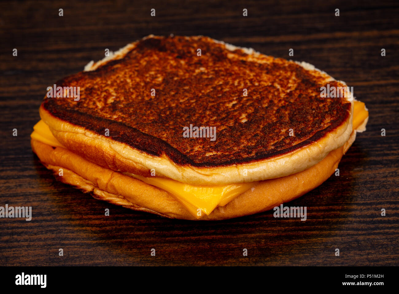 Toast with cheese over wooden Stock Photo - Alamy