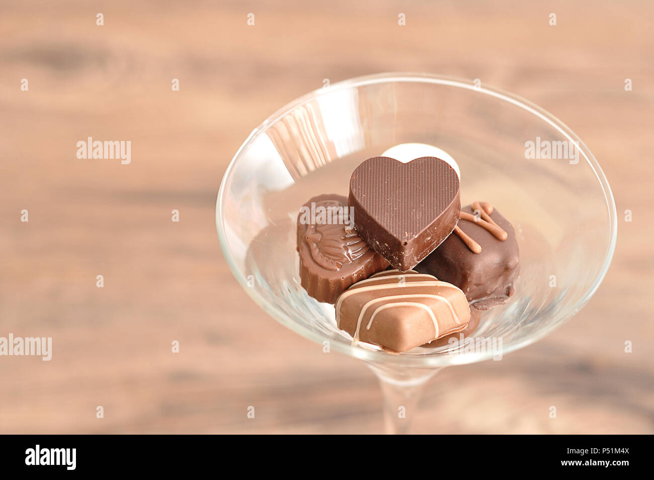 A variety of small chocolates displayed in a martini glass Stock Photo ...