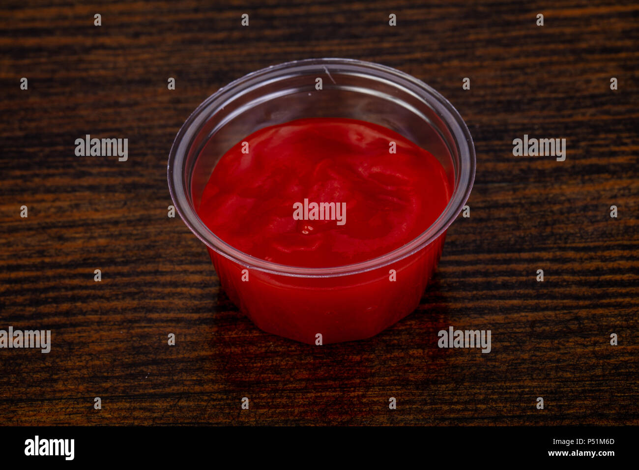 Ketchup sauce portion over wooden Stock Photo - Alamy
