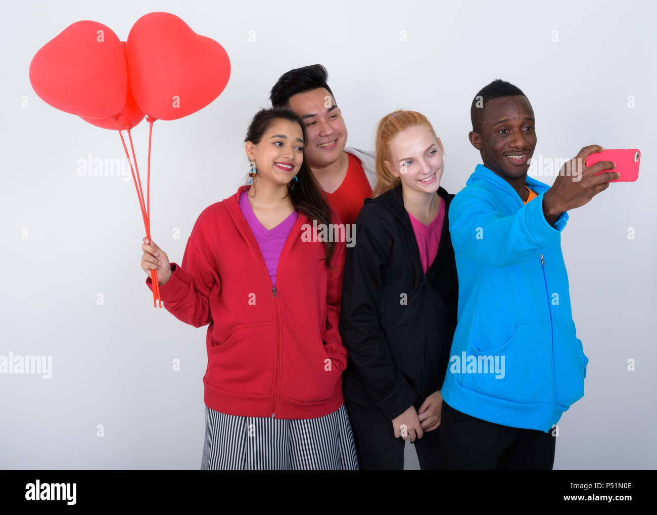 Happy diverse group of multi ethnic friends smiling and taking s Stock ...