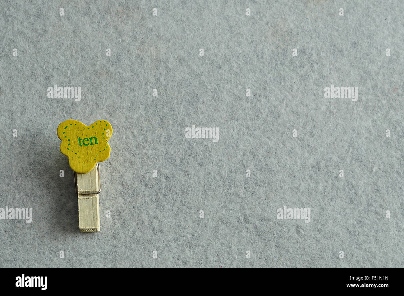 The word ten on a colorful peg on a white background Stock Photo - Alamy