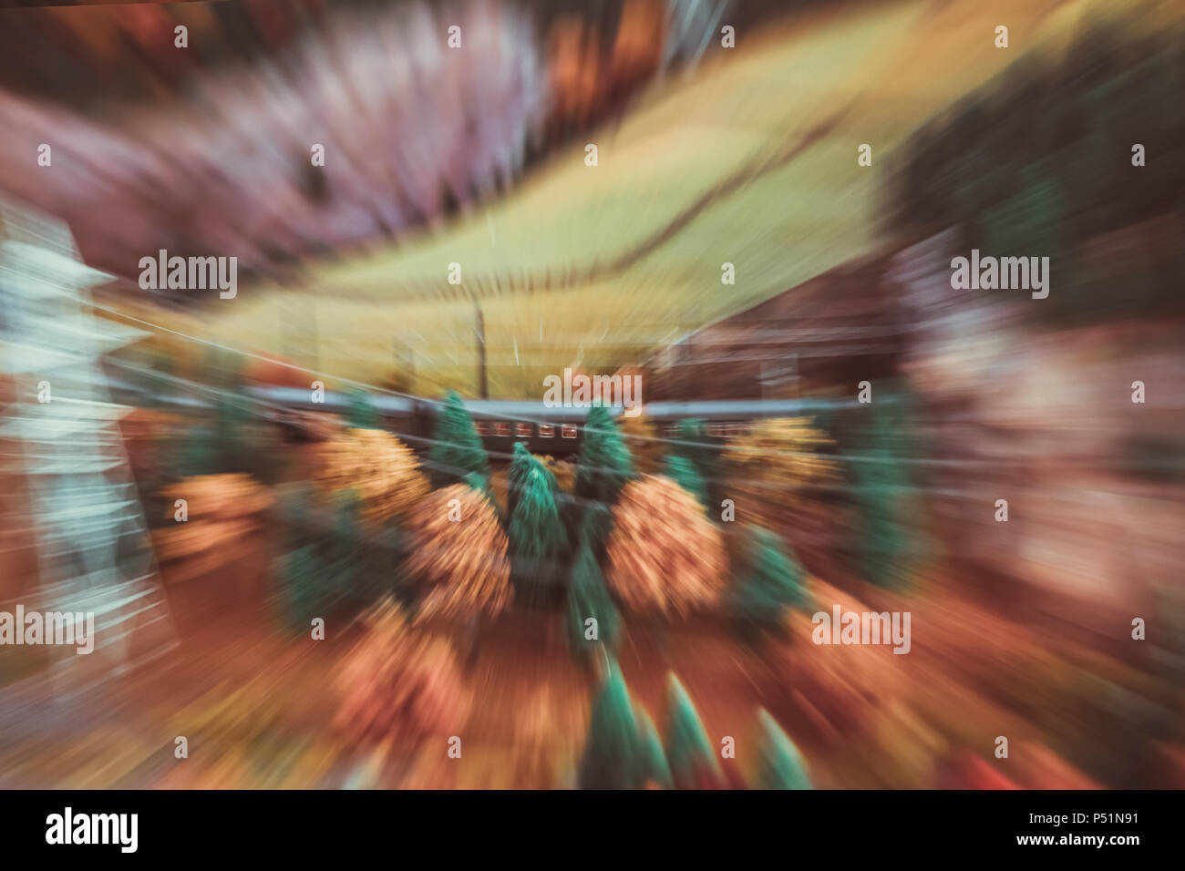 blur or defocused image of reduced train model on the tracks ...