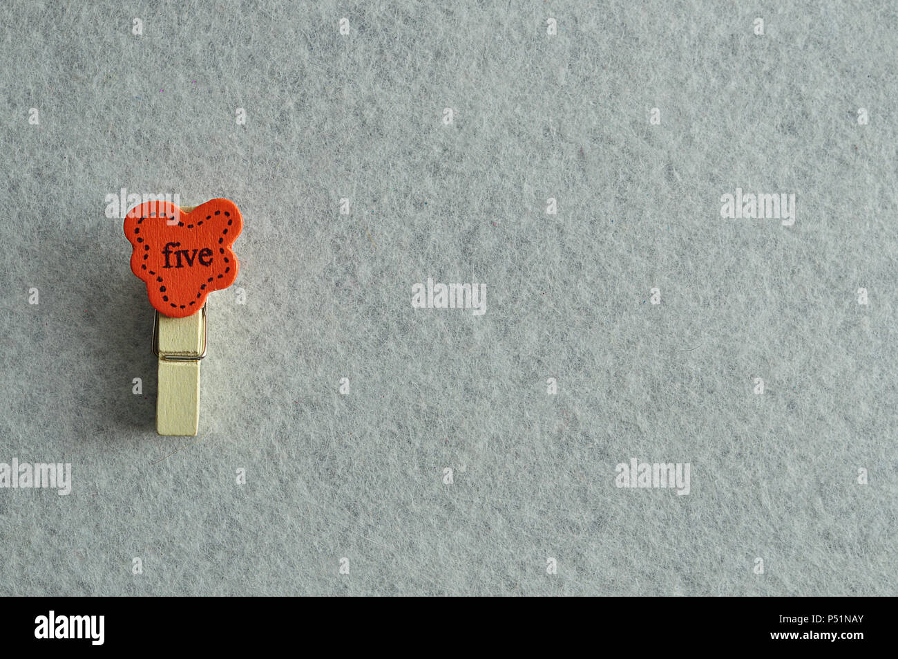 The word five on a colorful peg on a white background Stock Photo - Alamy