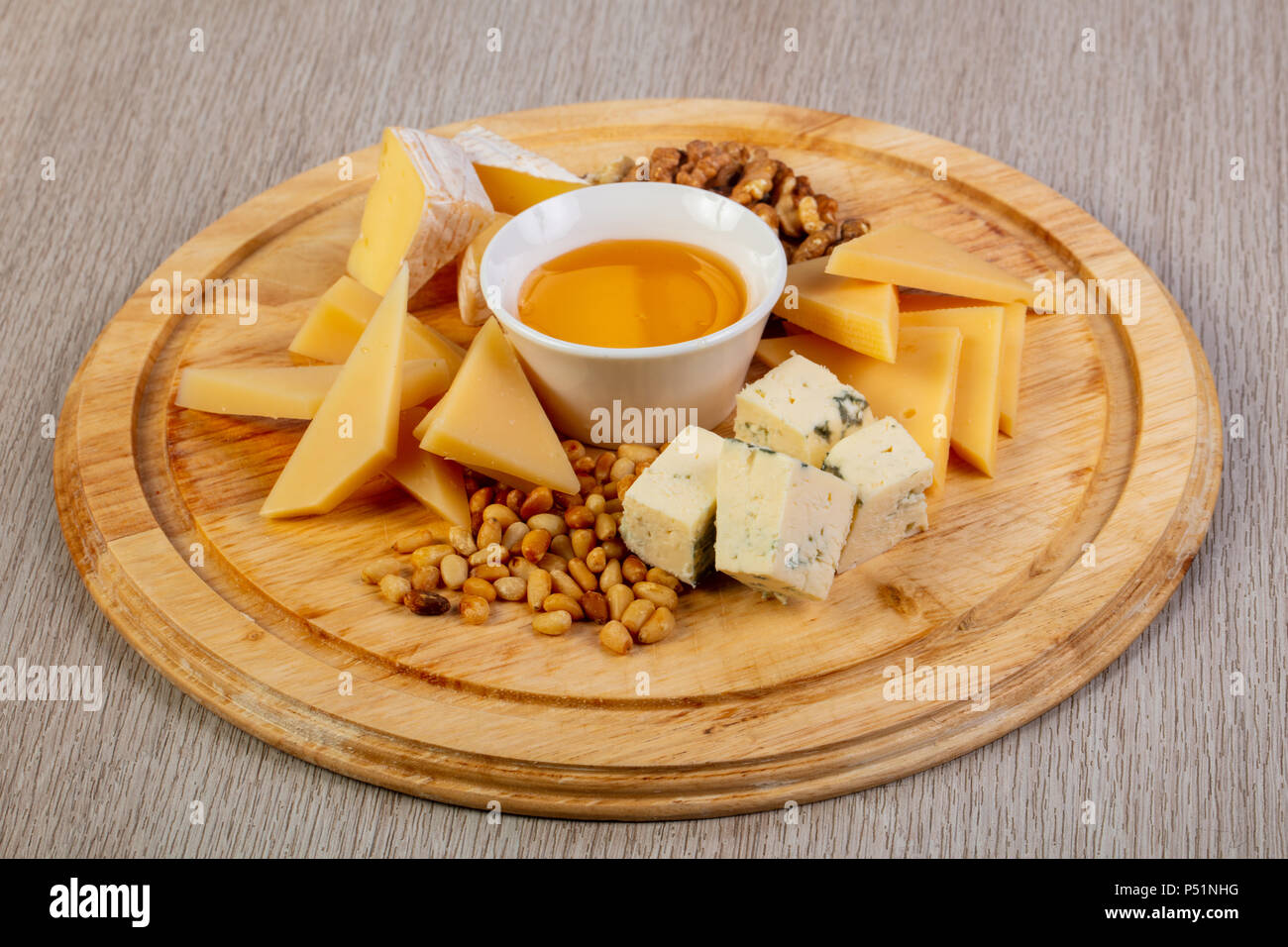 Cheese plate mix with honey Stock Photo - Alamy