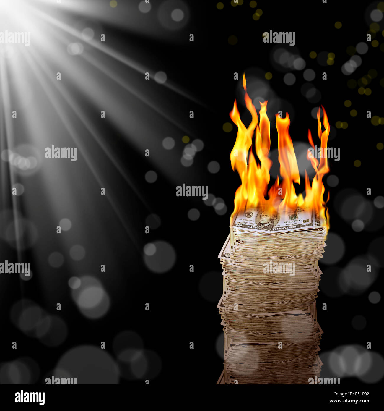 close up shot of burning money pile over black background Stock Photo ...