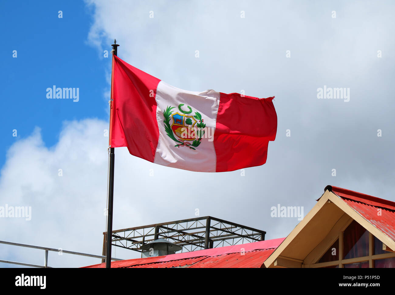 Flag of Peru waving in the sky Stock Photo - Alamy