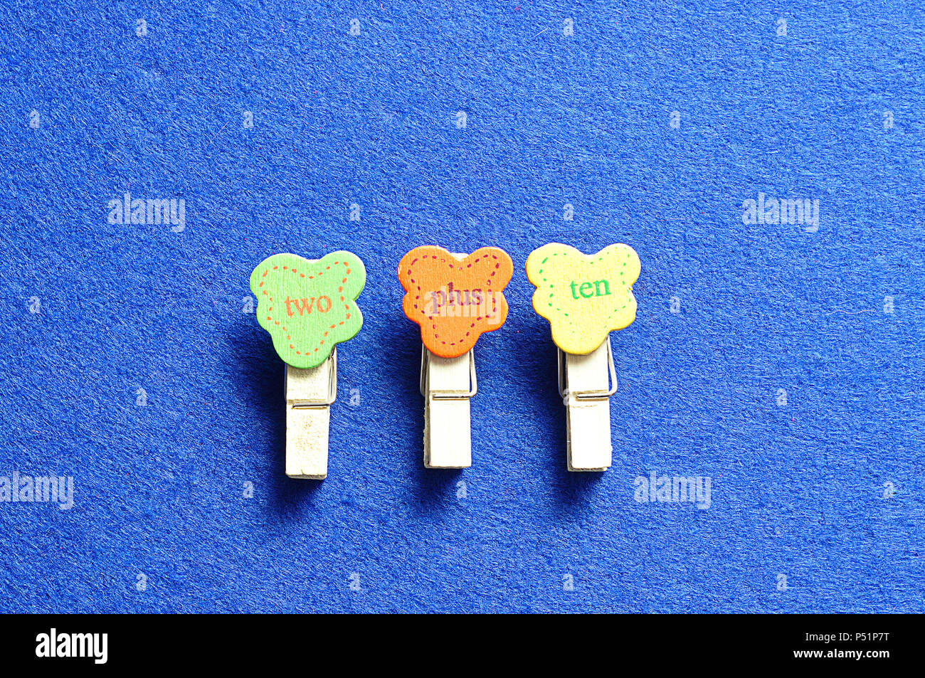 Two plus ten on a blue background Stock Photo - Alamy