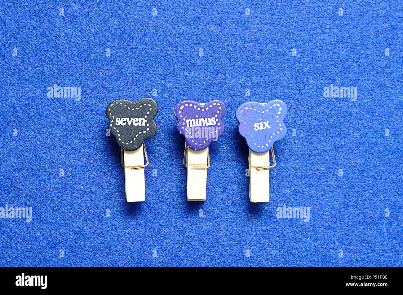 Seven minus six on a blue background Stock Photo - Alamy