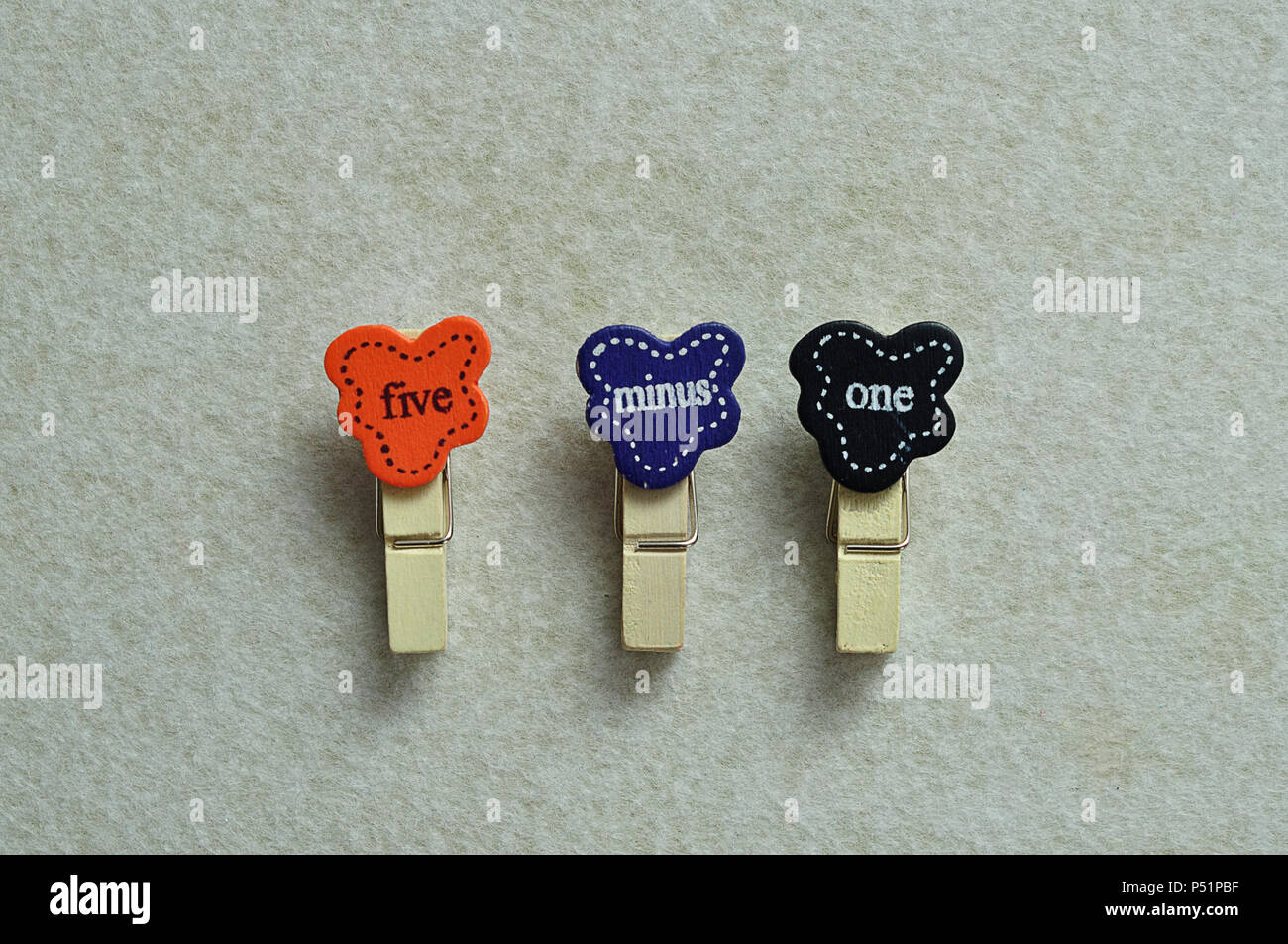 Five minus one on a white background Stock Photo - Alamy