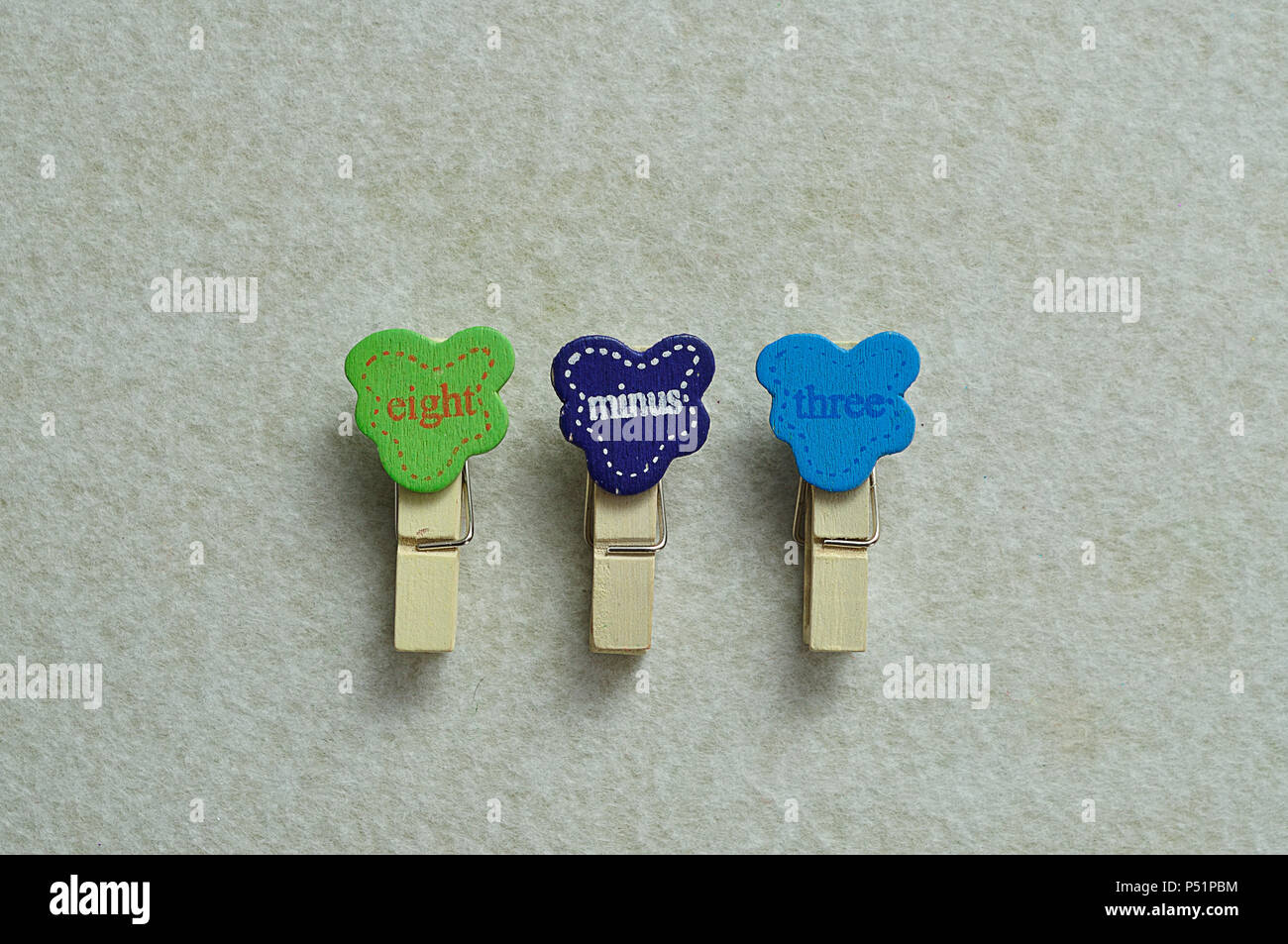 Eight minus three on a white background Stock Photo - Alamy